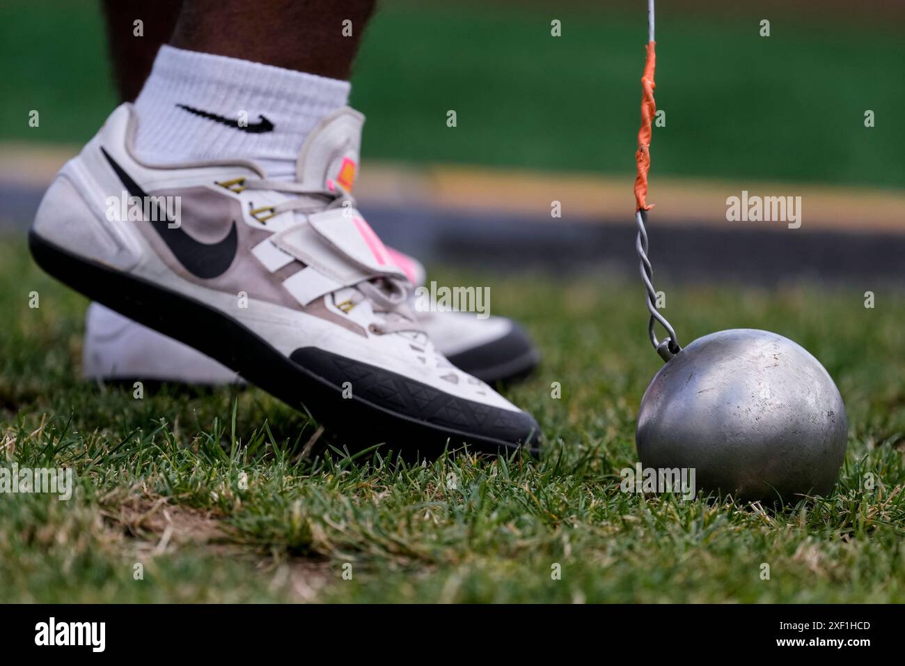 Tarik O'Hagan holds his hammer before competing in the men's hammer ...