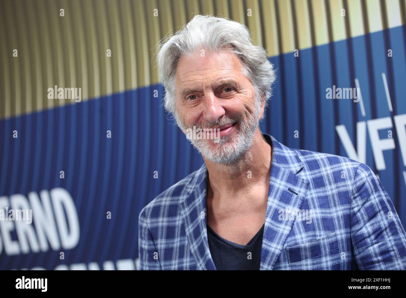Munich, Germany. 30th June, 2024. Actor Rufus Beck stands on the red ...