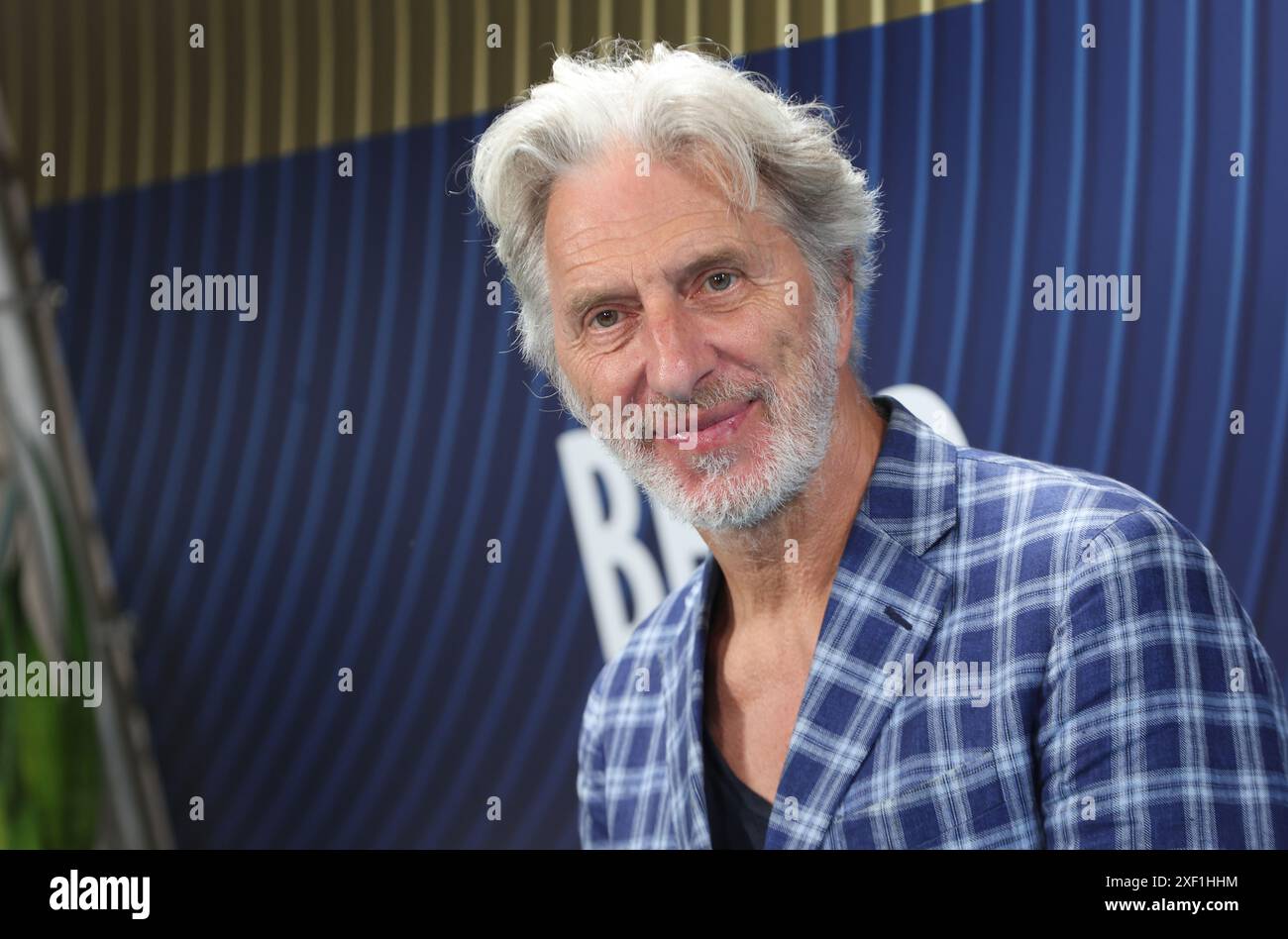 Munich, Germany. 30th June, 2024. Actor Rufus Beck stands on the red ...