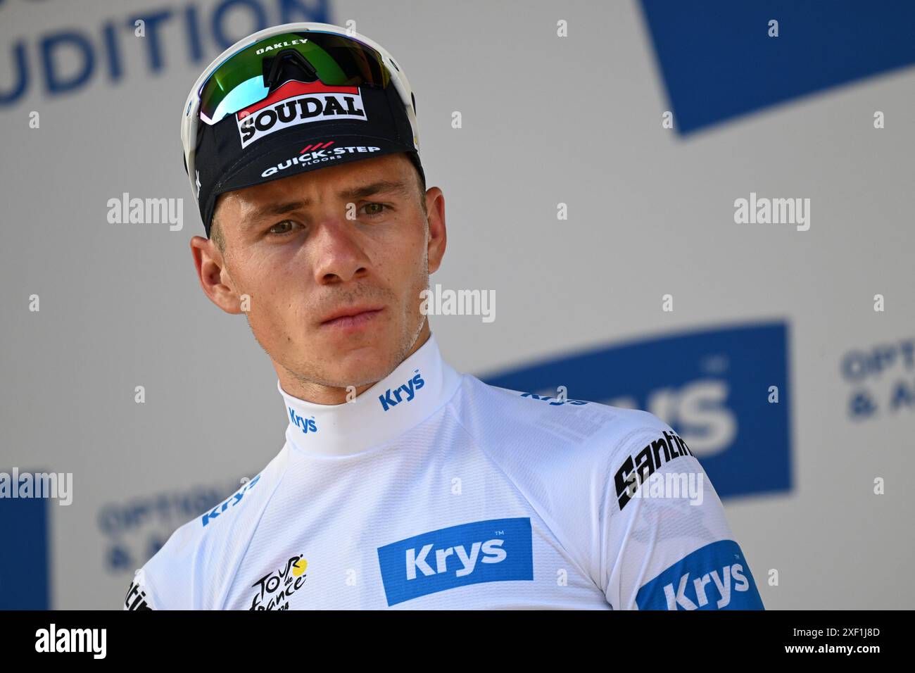 Remco Evenepoel portrait in WHITE JERSEY ON THE PODIUM OF THE second ...