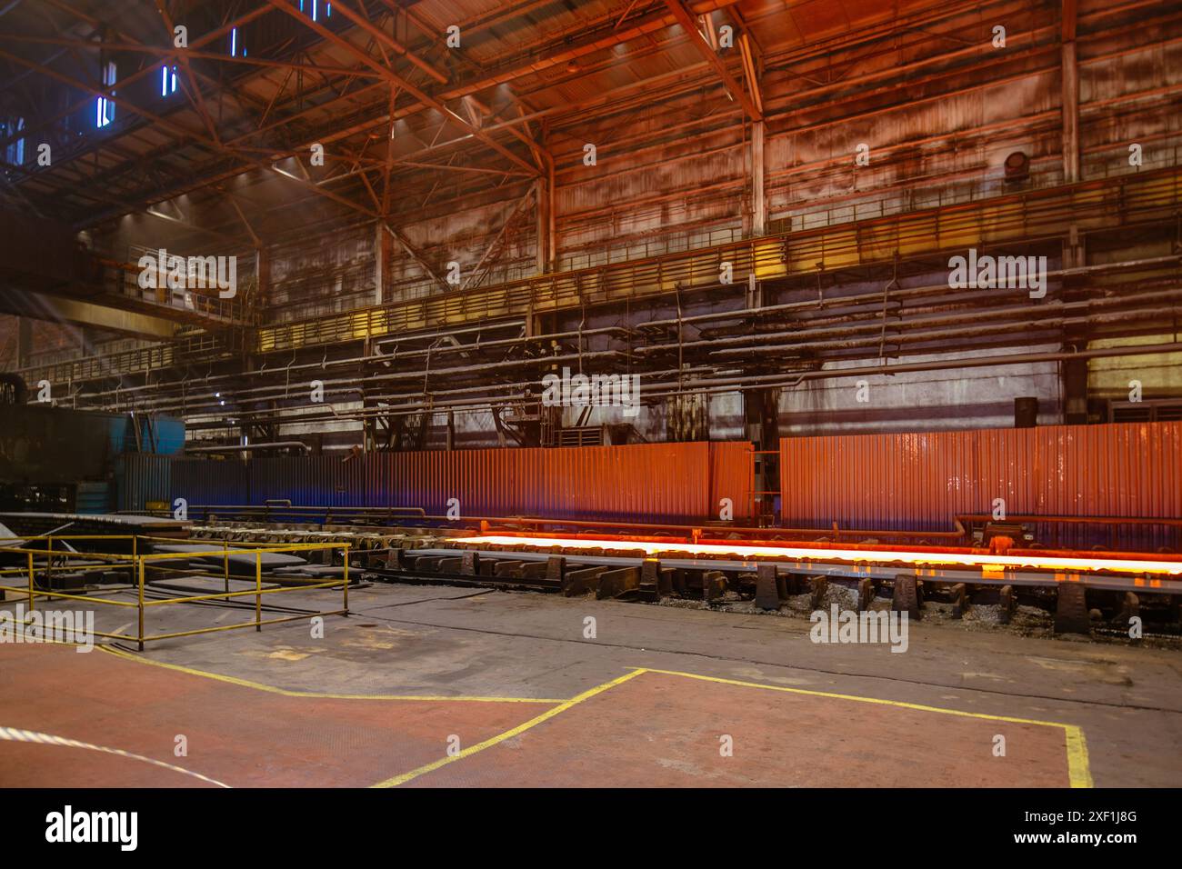 Rolled metal factory. Hot iron slab moving on conveyor of metal rolling mill Stock Photo - Alamy