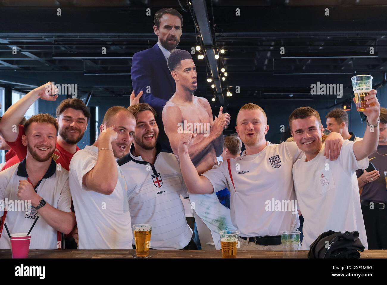 London, UK, 30th June, 2024. England fans pose with cardboard cutouts ...