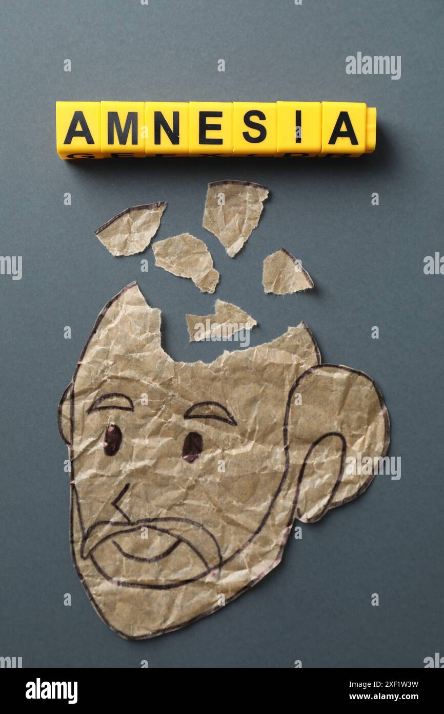 Yellow cubes with word Amnesia and human head with brain pieces made of ...