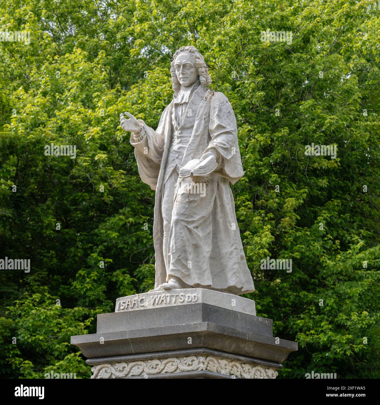Close-up of the Isaac Watts monument memorial statue against a backdrop of trees in Watts Park ...