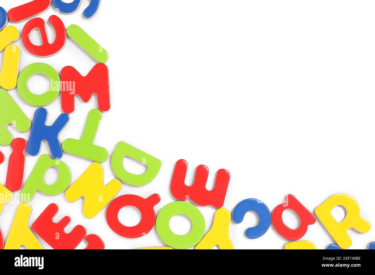 Alphabet. Many colorful magnetic letters isolated on white, top view ...