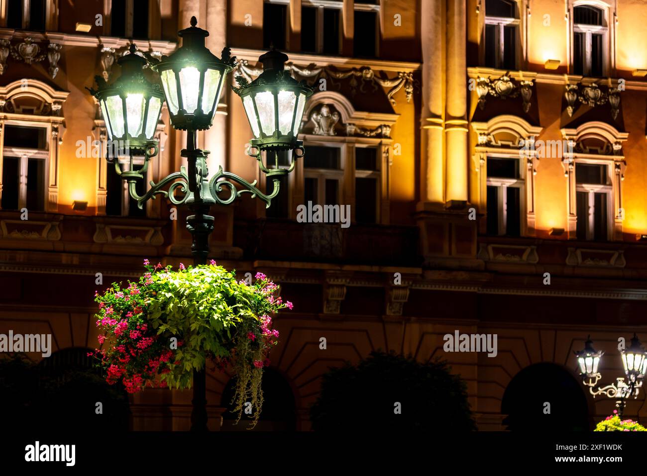 Vintage street iron lamp in the center of Novi sad in Serbia at night ...