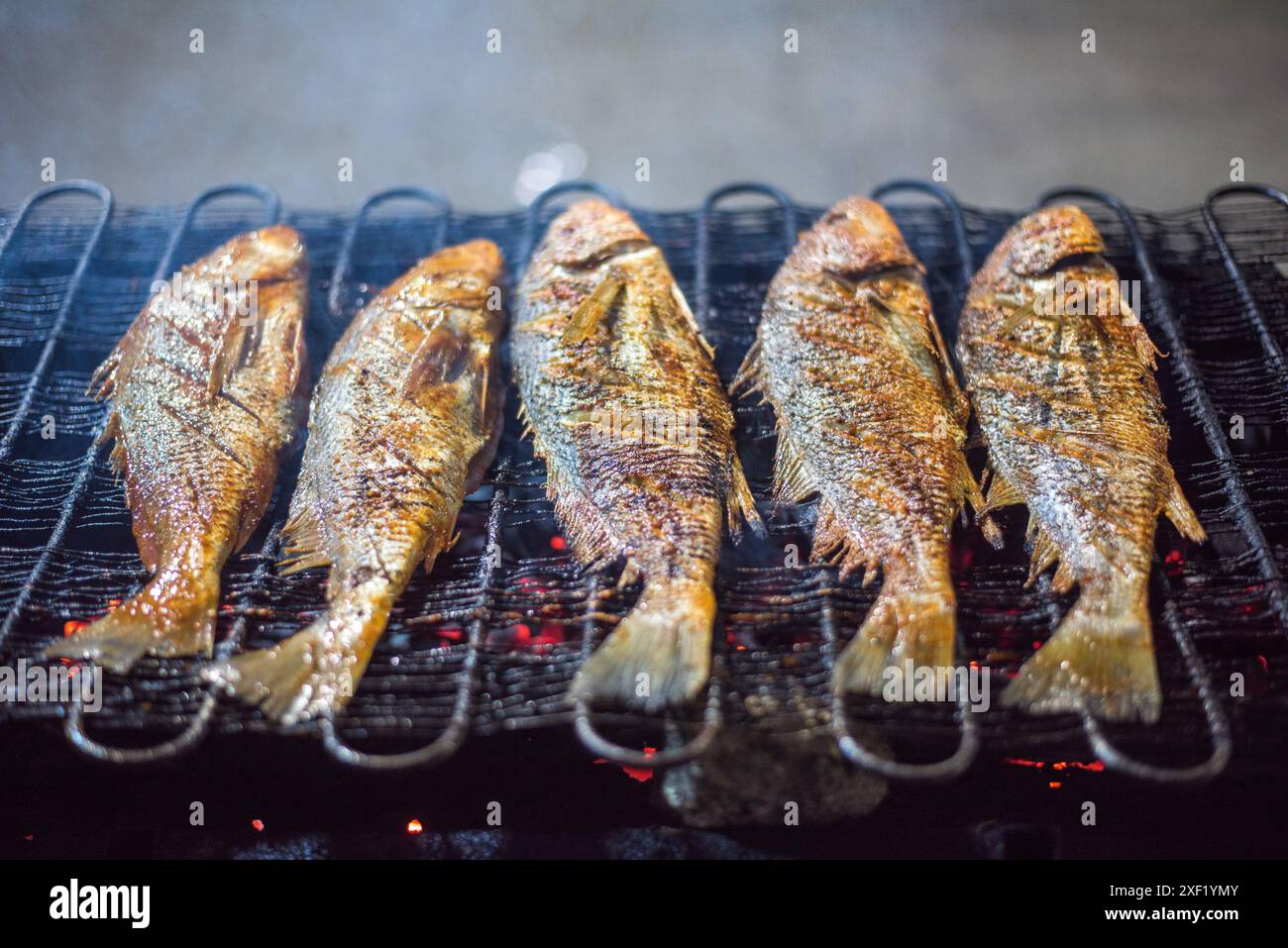 Grilled fish on the grill Stock Photo - Alamy
