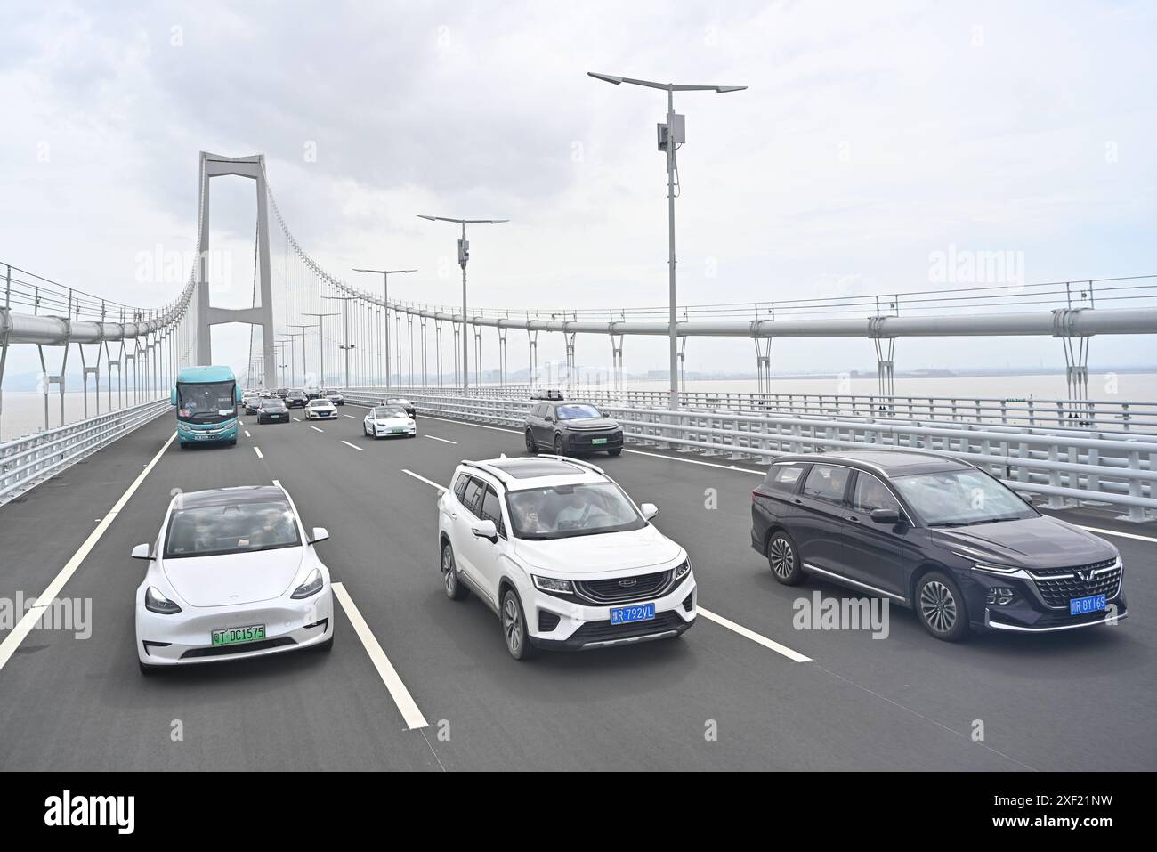 ShenZhen, China.30th June 2024.Vehicles drive on the Shenzhong Bridge ...