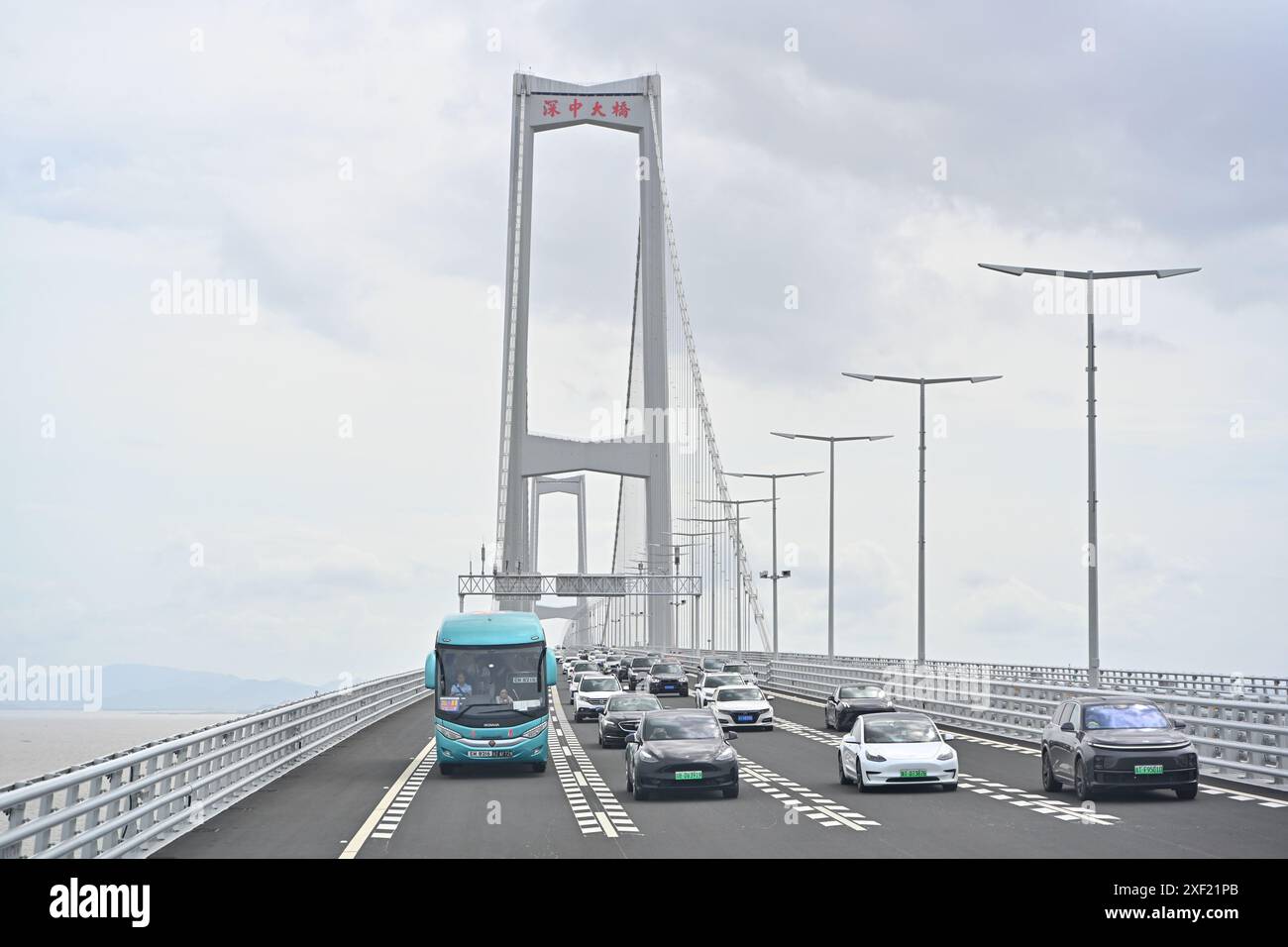ShenZhen, China.30th June 2024.Vehicles drive on the Shenzhong Bridge ...