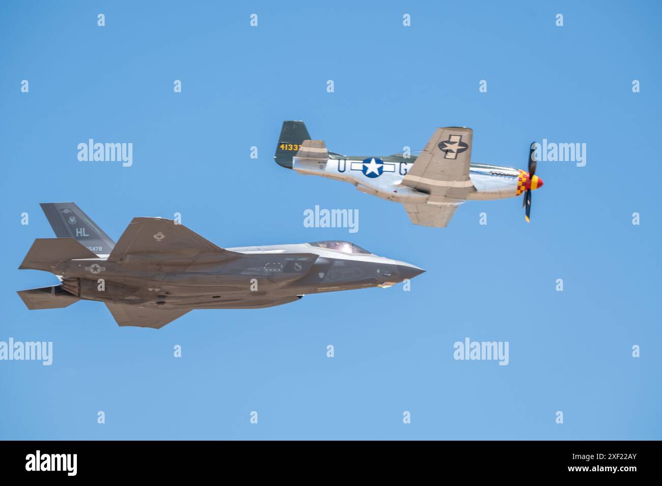 A P-51 Mustang performs a flyover alongside an F-35 Lightning II as ...