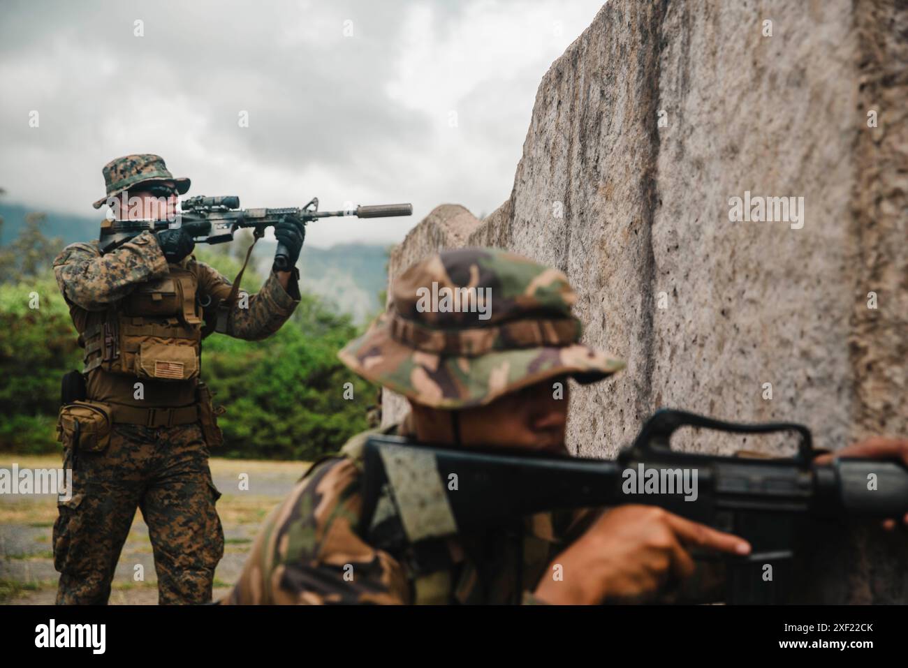 U.S. Marine Corps Lance Cpl. George Reese, left, a combat engineer ...