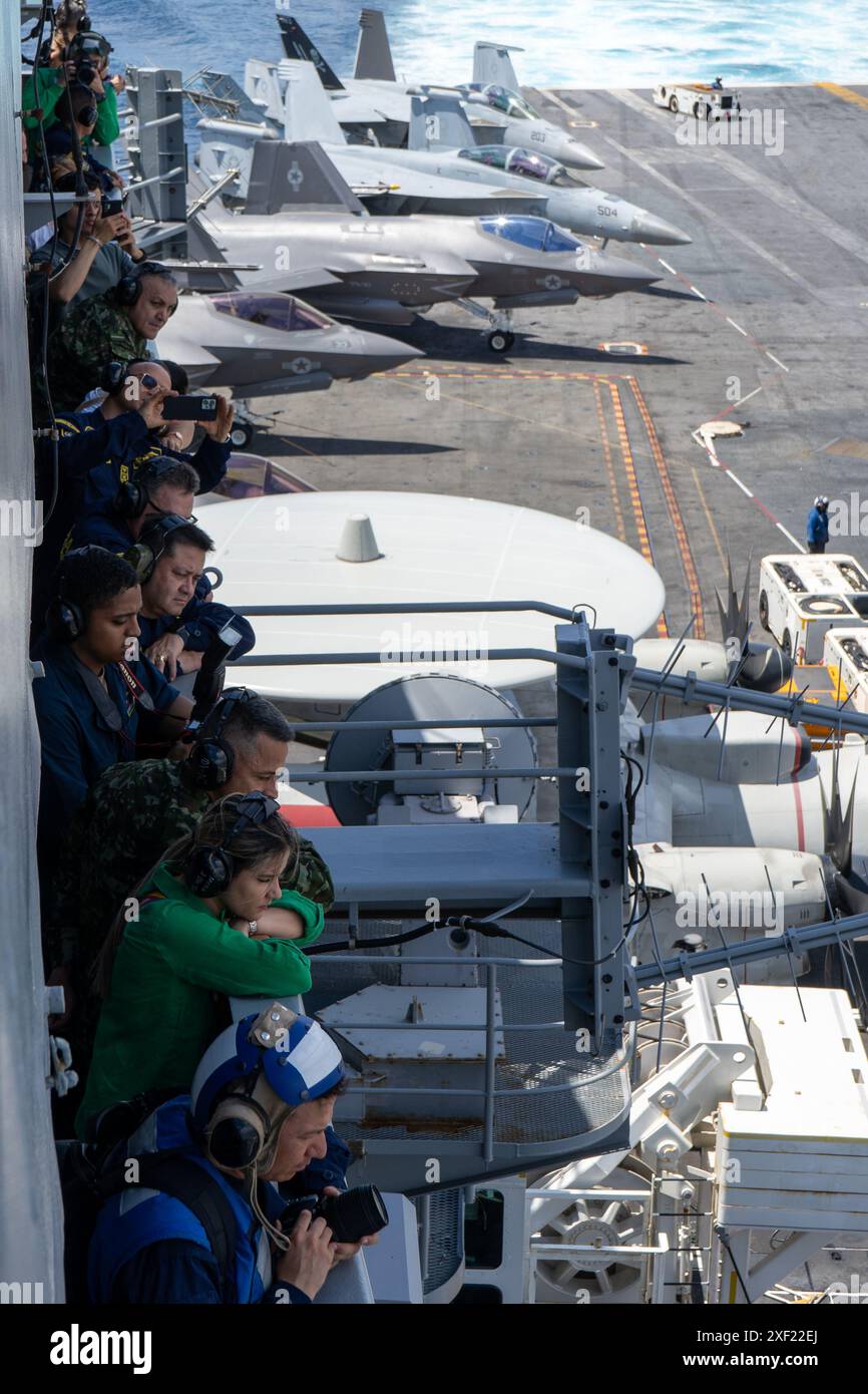 The official Colombian party and U.S. Navy Sailors observe flight ...