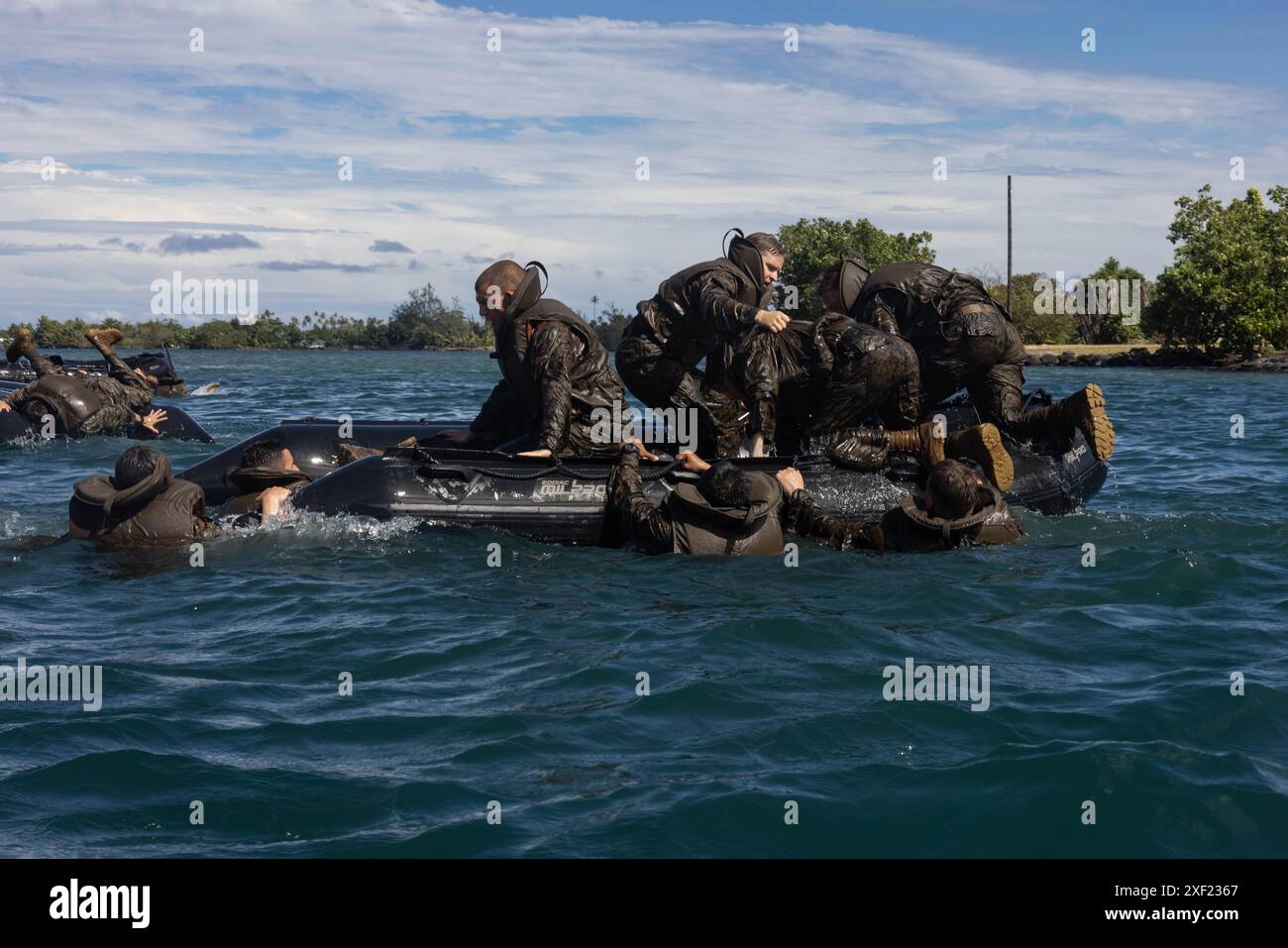 U.S. Marines with 1st Marine Division climb into a combat rubber ...