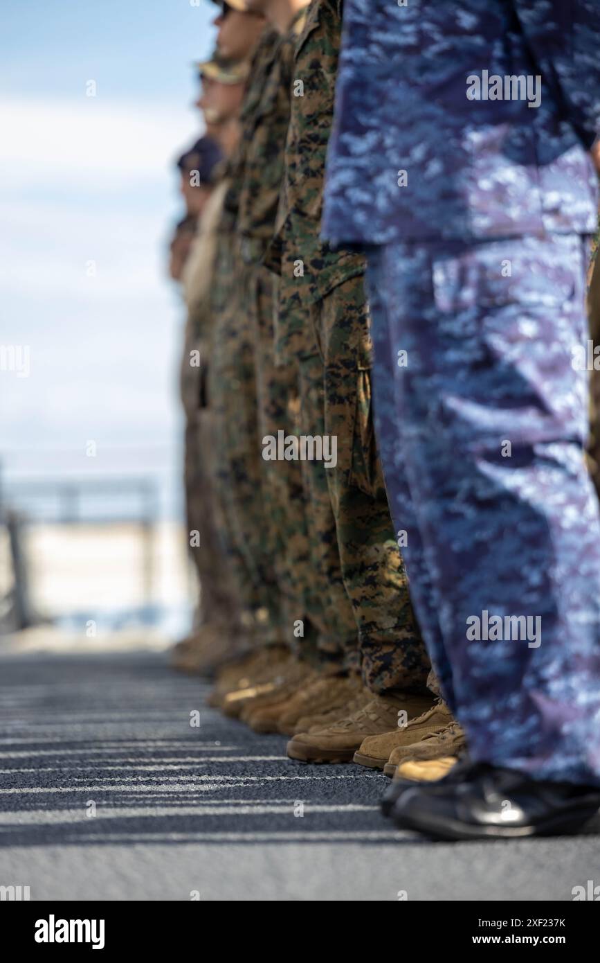 U.S. service members, French soldiers, and Japanese sailors stand in ...