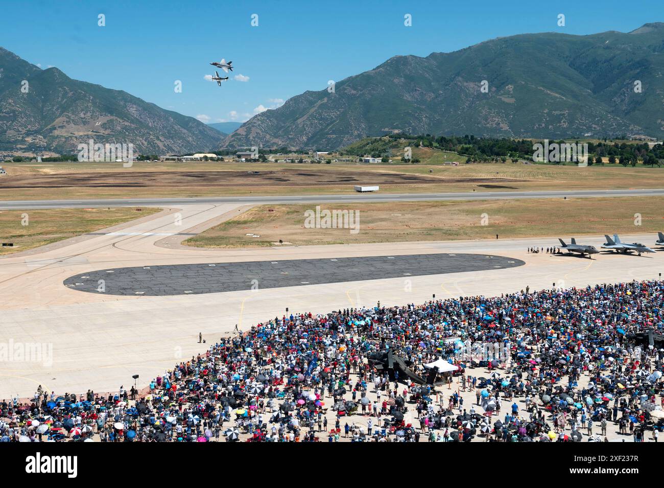 Crowds gather to watch an F-35A Lighnting II fly side by side with a P ...