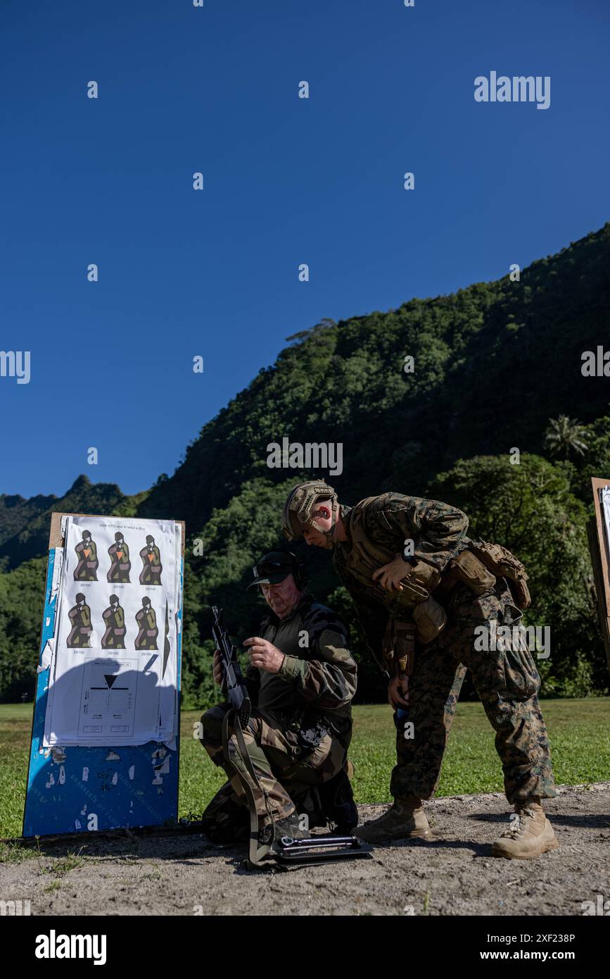 U.S. Marine Corps Cpl. Konnor Whipple, right, a squad leader with Bravo ...