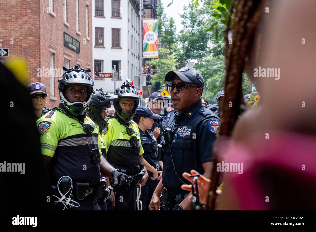 NYPD stand by waiting for the command to arrest during the rally. Queer ...