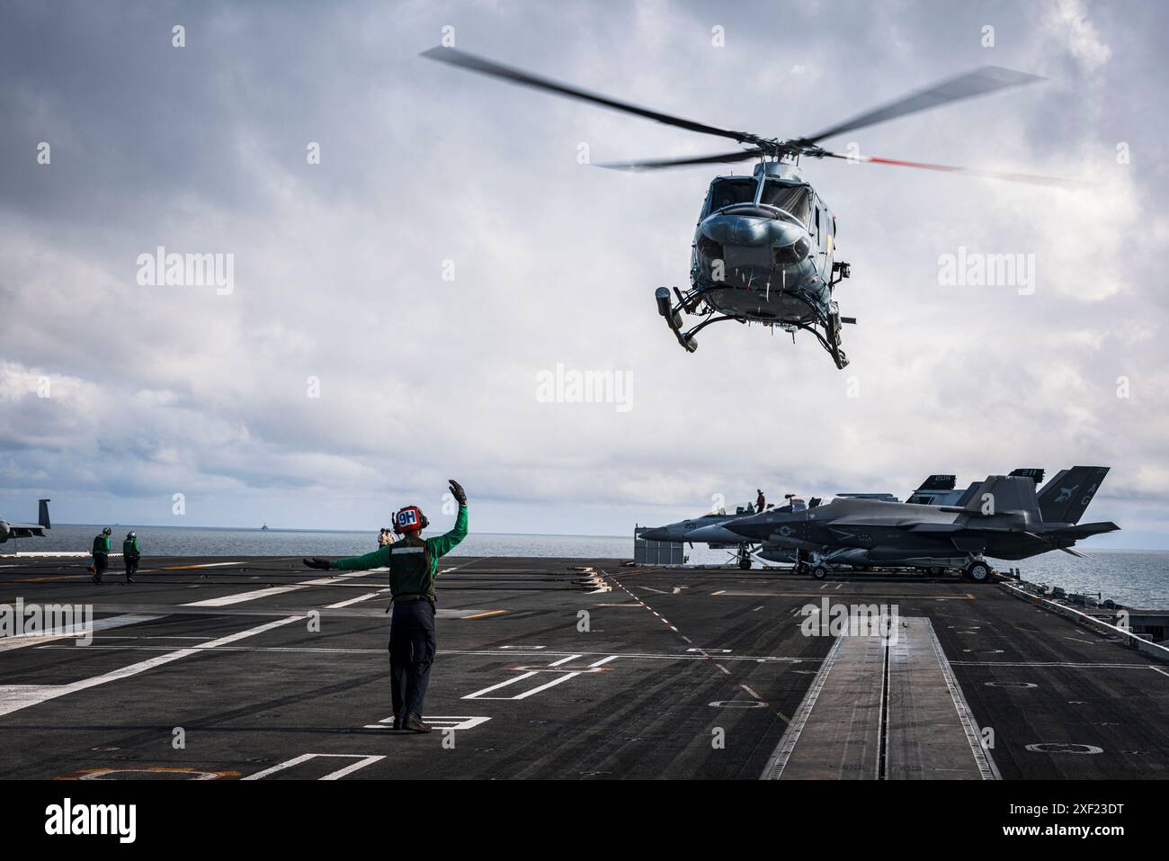 A Colombian navy Bell 412 helicopter lands on the flight deck of Nimitz ...