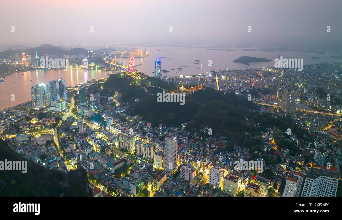 Aerial view of Ha Long cityscape at twilight period. Urban development ...