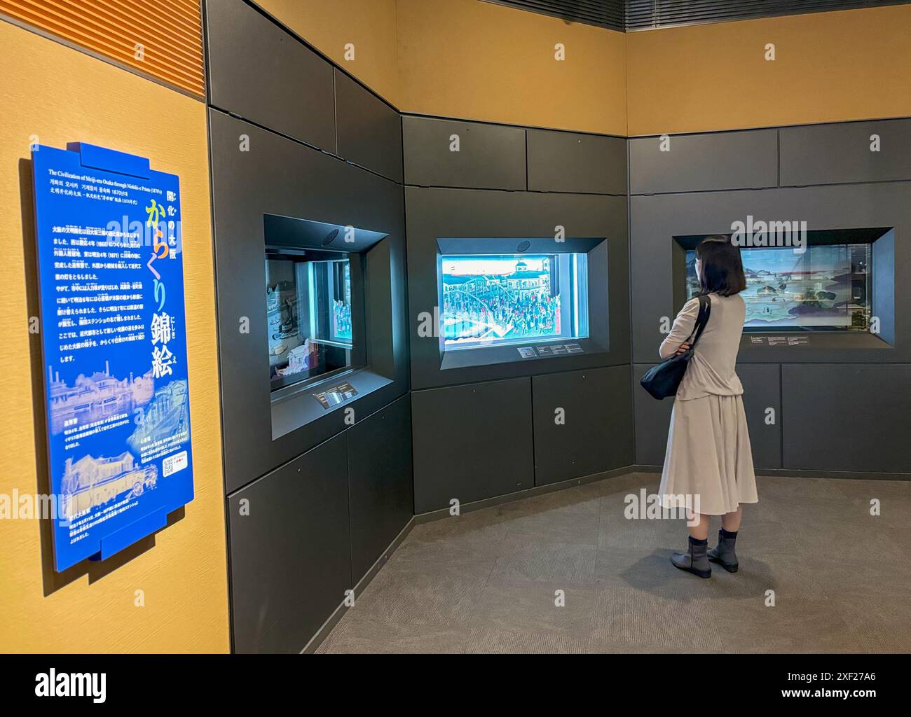 A visitor looking models of Osaka city during their visit to the Osaka ...
