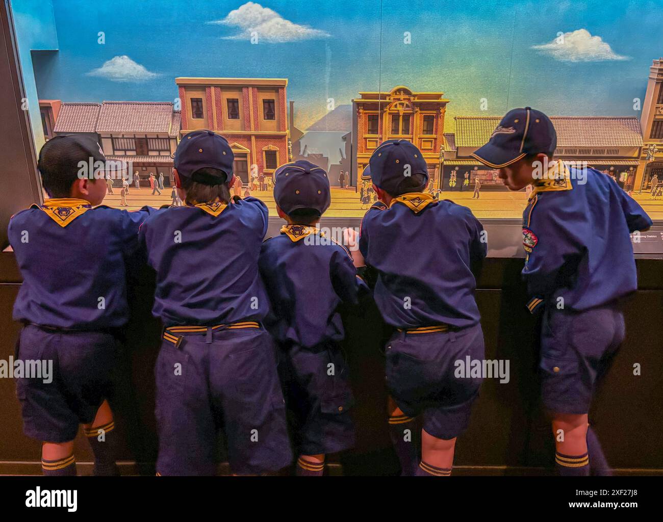 Boy Scouts visitors looking models of Osaka city during their visit to ...