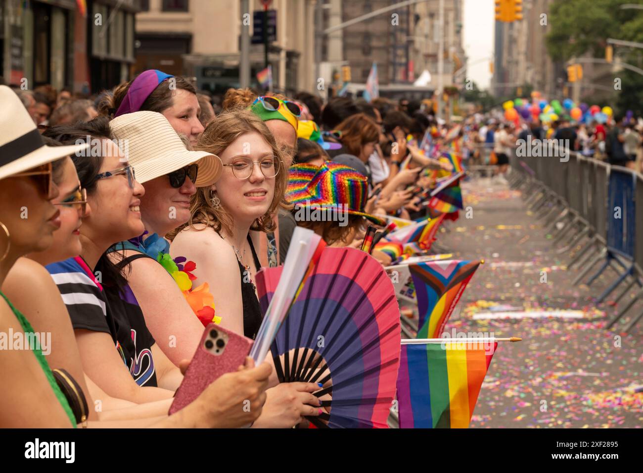 NEW YORK, NEW YORK - JUNE 30: Thousands of spectators with pride flags ...