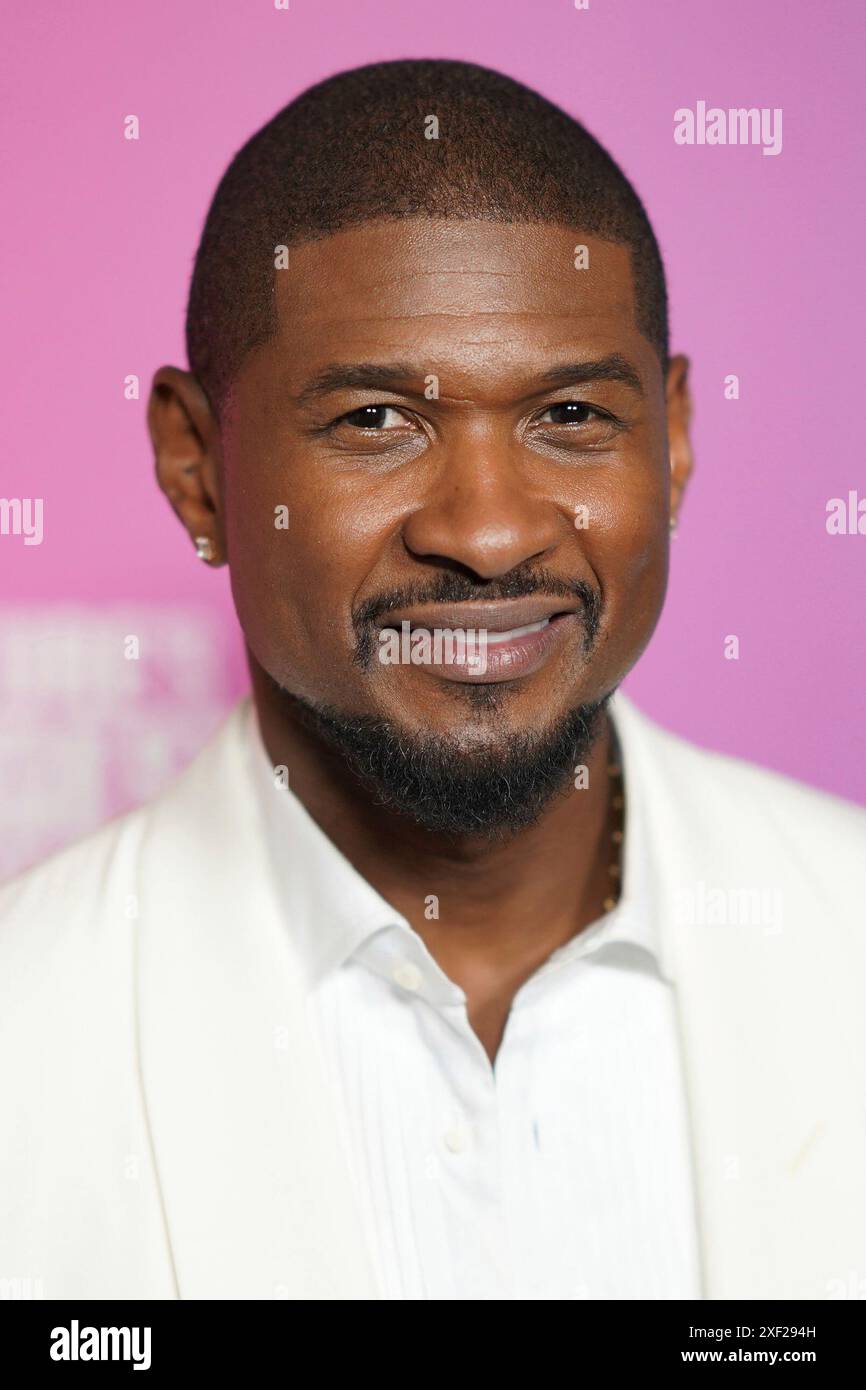 Usher, recipient of the Lifetime Achievement award, poses in the press ...