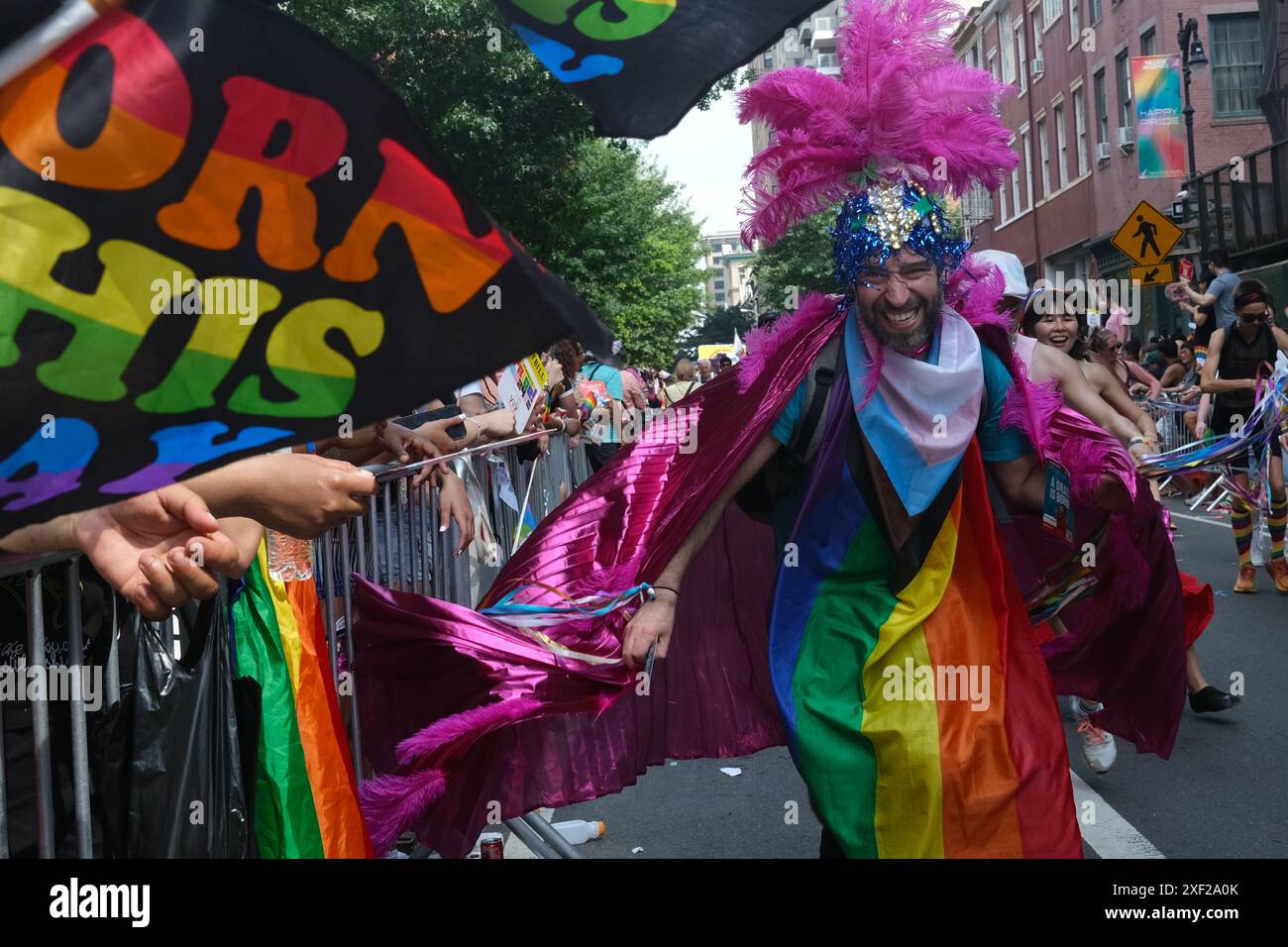 New York, United States. 01st July, 2024. A parade marcher dances with ...
