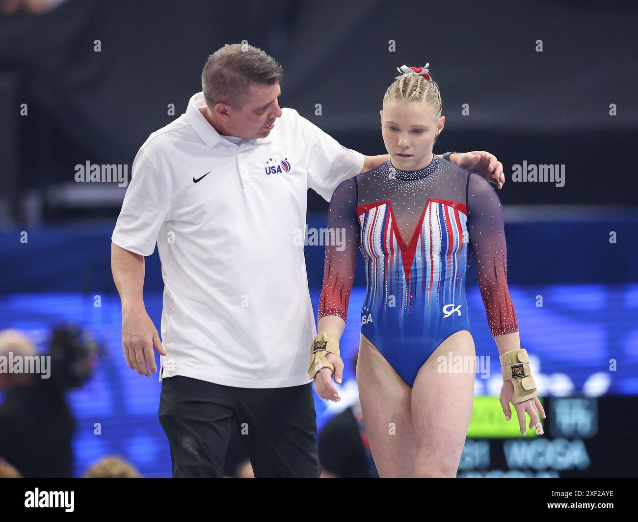 Minneapolis, USA. June 30, 2024: Jade Carey is counseled by her coach and father, Brian Carey ...