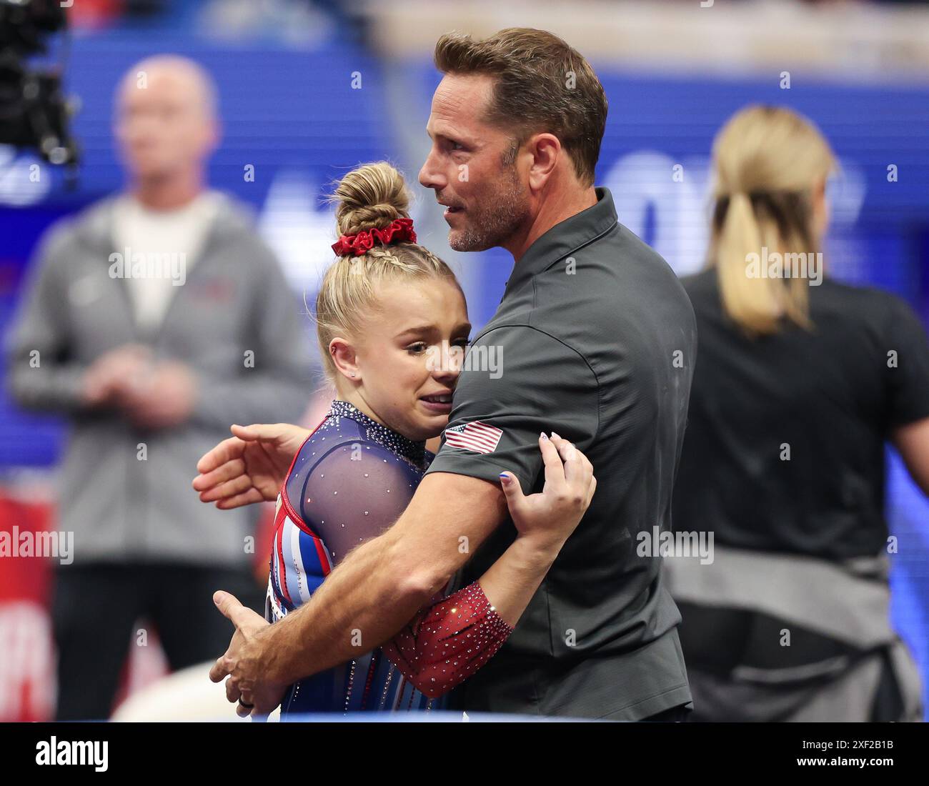 June 30, 2024: Joscelyn Roberson is embraced by her coach, Laurent Landi, following her final ...