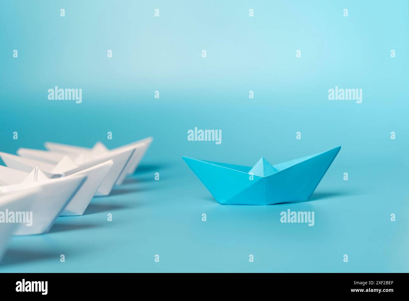 Leadership Concept with Paper Boats. Leadership concept with blue paper ...