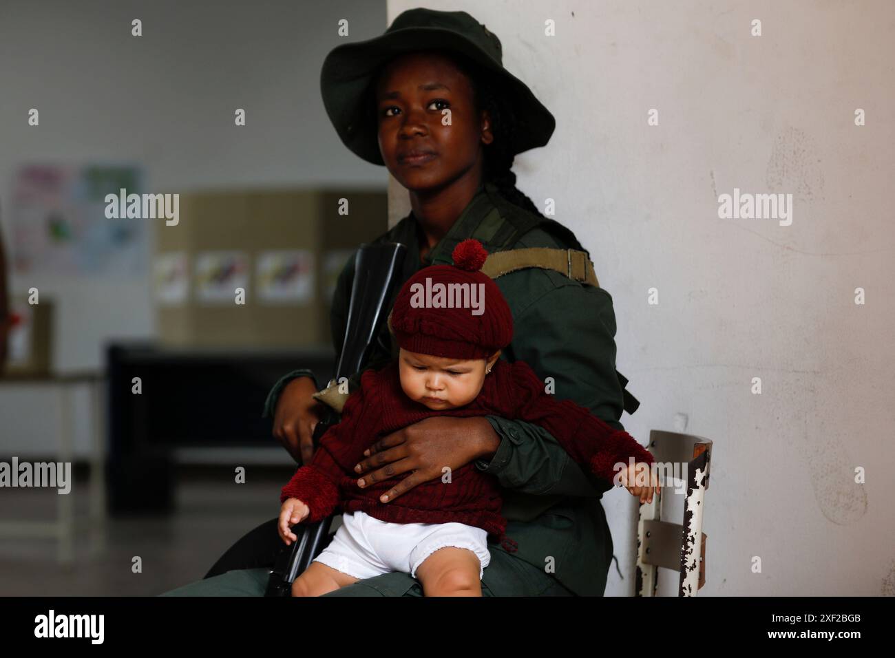 dpatop - 30 June 2024, Venezuela, Caracas: A member of the Venezuelan ...