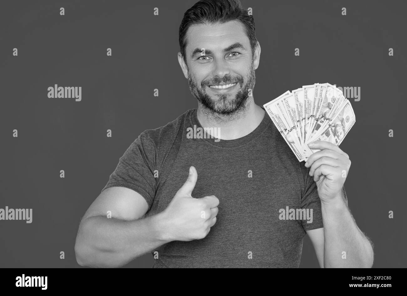 Handsome man pointing dollar Black and White Stock Photos & Images - Alamy