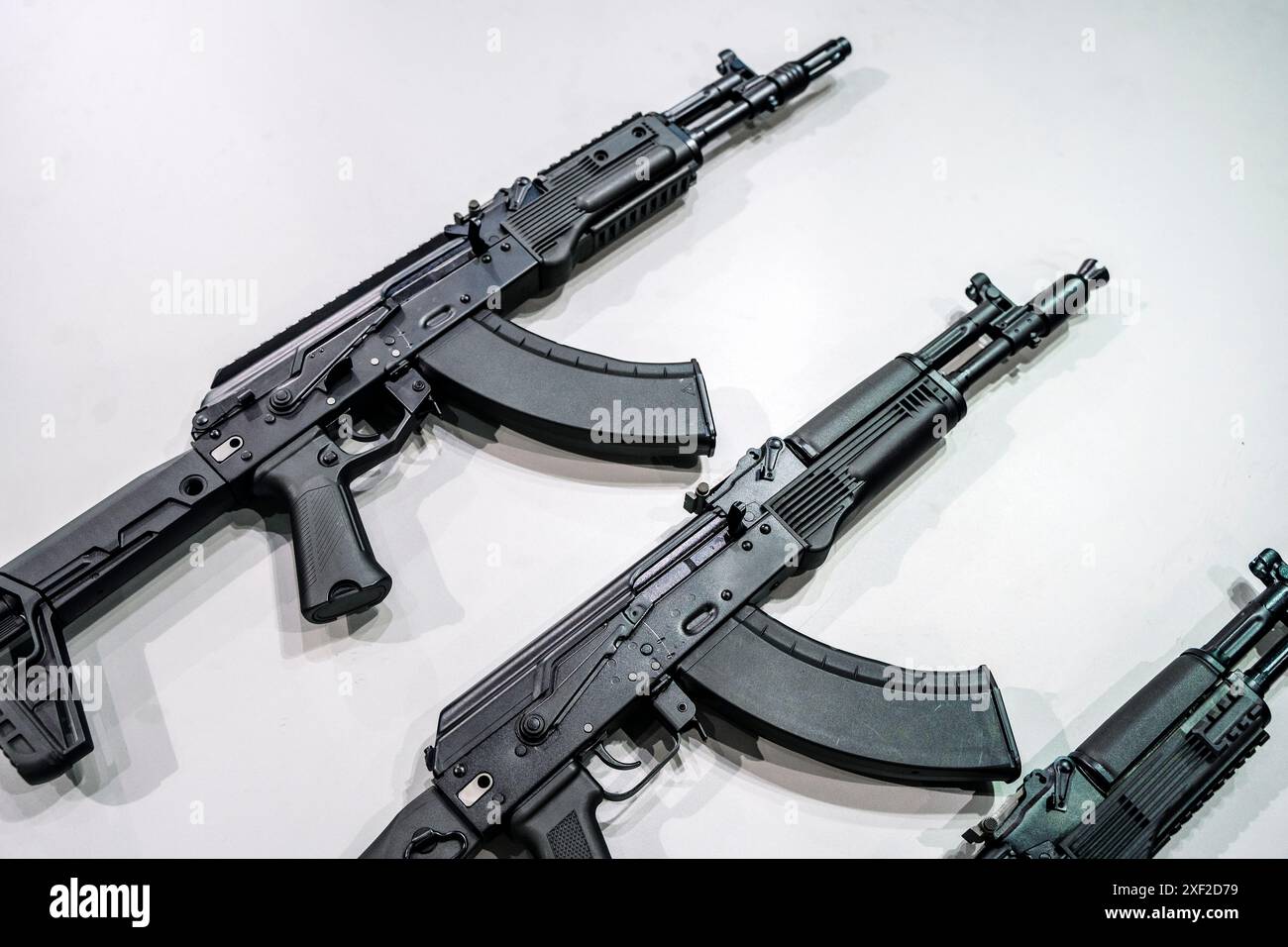 Modern weapons automatic rifles and machine gun on the counter ...