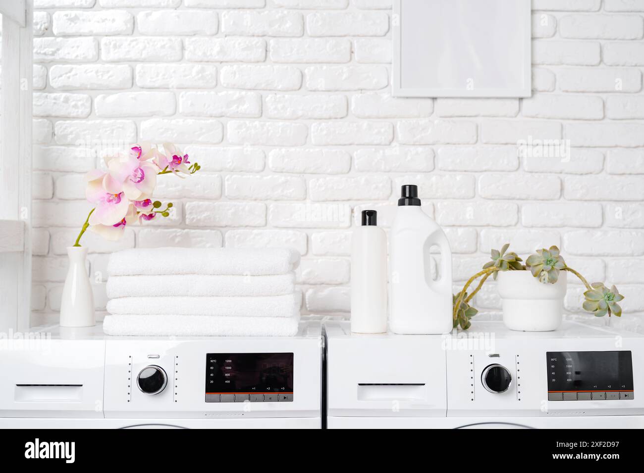 Two White Front Loading Washing Machines in Modern Laundry Room Stock ...