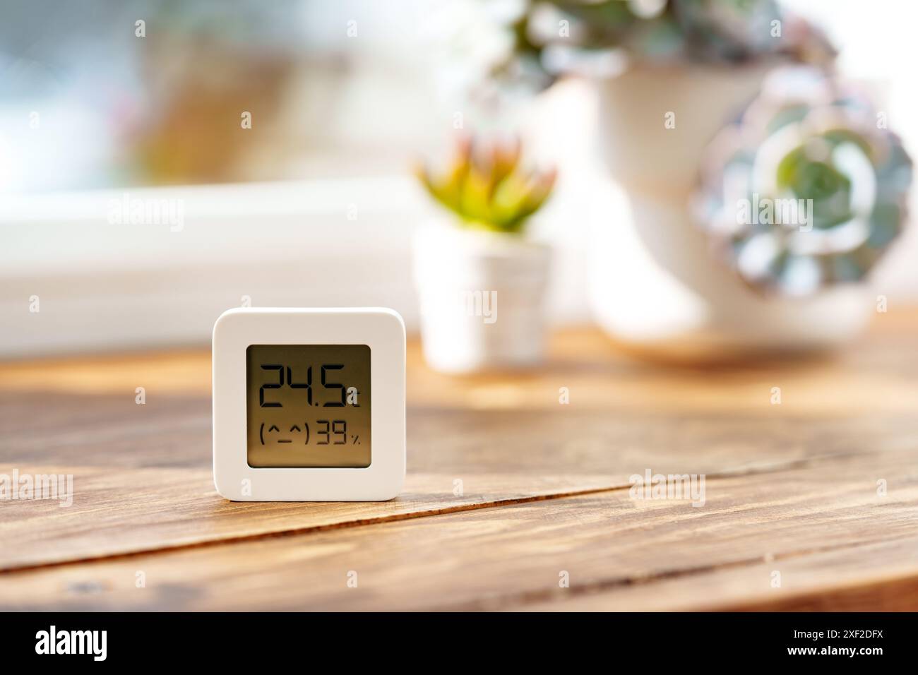 Digital Thermometer Displaying Temperature and Humidity Near Window ...