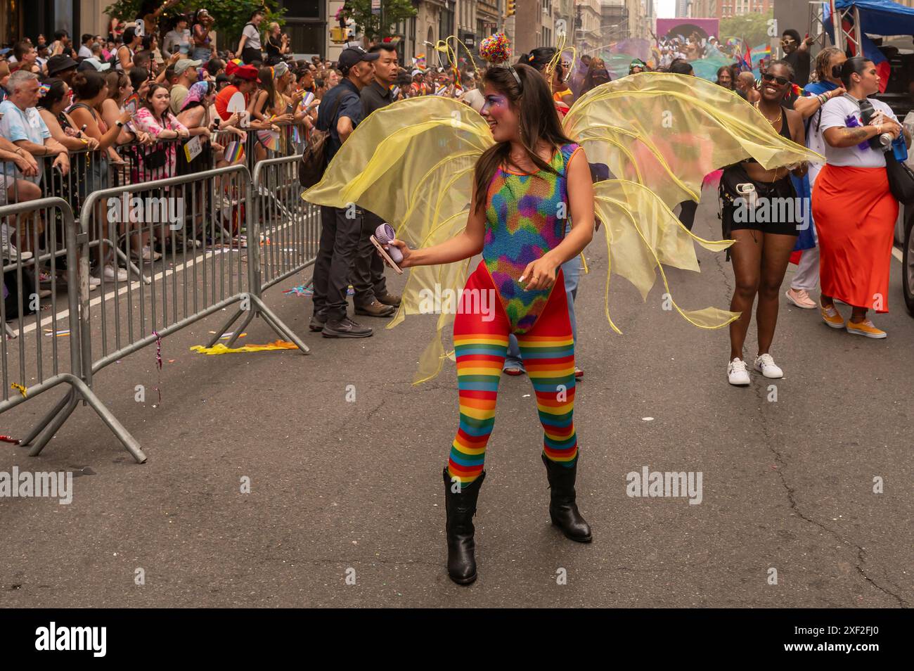 A marcher interacts with spectators during the annual New York City ...