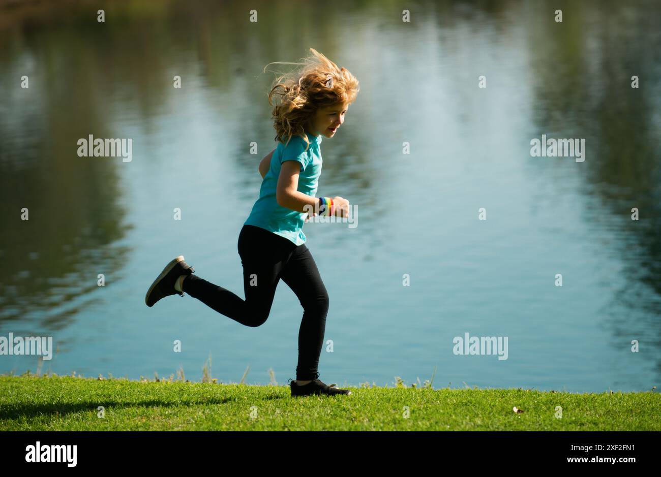 Kid runners run on lawn in park. Child running outdoor. Healthy sport ...