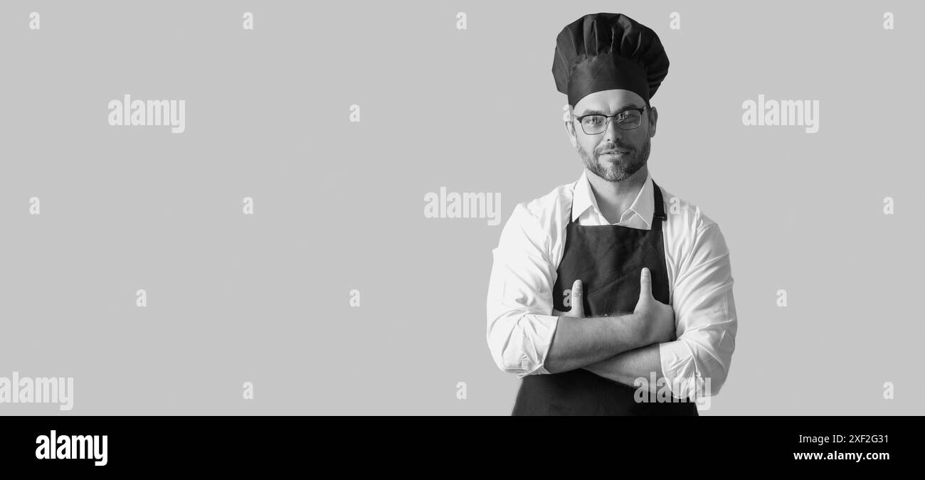 A male chef isolated over grey background. Chef Man in chef hat ...