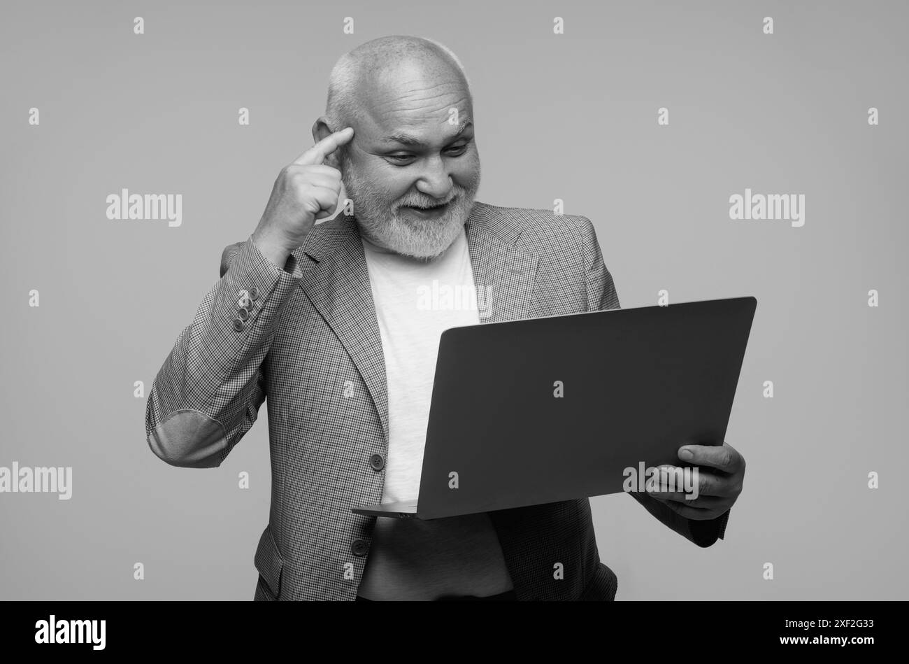 Older man hold laptop computer. Old age using laptop pc isolated on ...