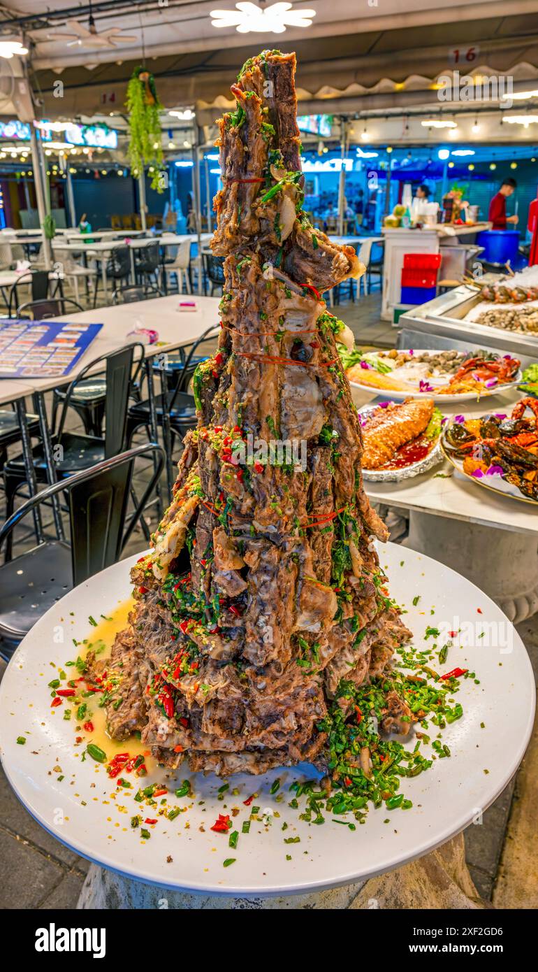 Famous Thai food dish called, “Leng Saap” stacked pork topped with ...