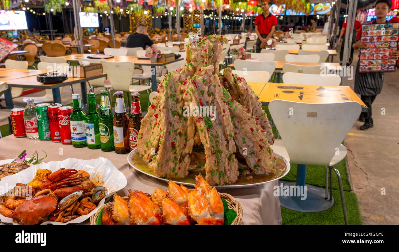 Famous Thai food dish called, “Leng Saap” stacked pork topped with ...
