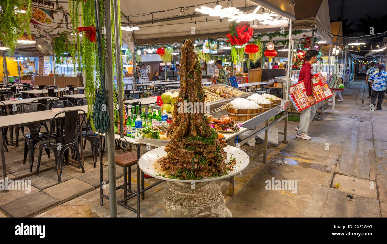 Famous Thai food dish called, “Leng Saap” stacked pork topped with ...