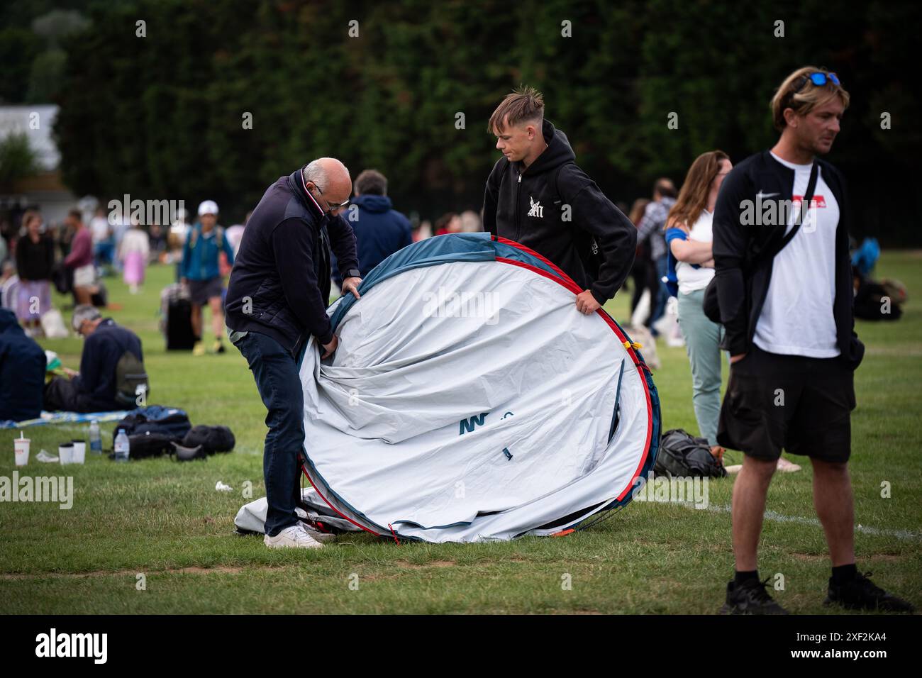 Spectators pack up their tent in the queue on day one of the 2024 ...