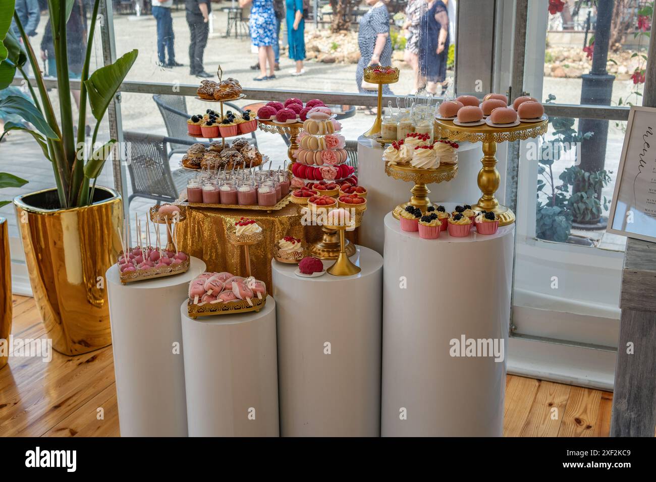 Empty Wedding Reception Dessert Table With Pink and Gold Decorations ...