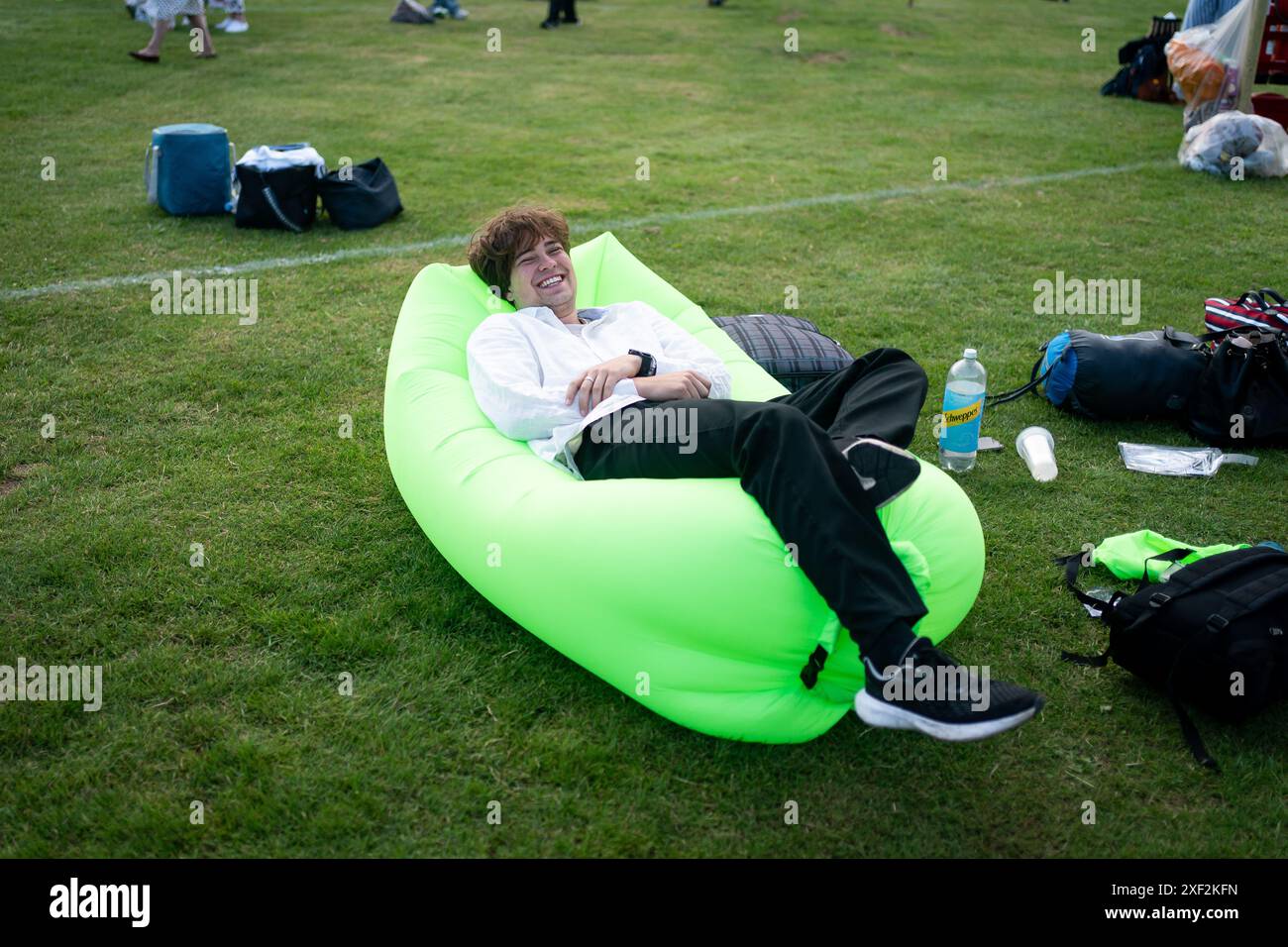 A spectator in the queue on day one of the 2024 Wimbledon Championships ...