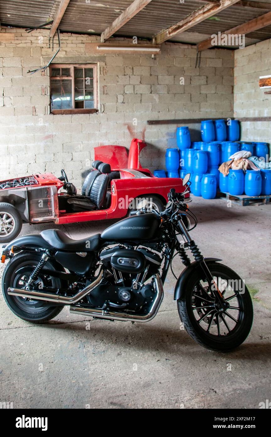 Harley Davidson motorcycle and MG sports car Stock Photo - Alamy