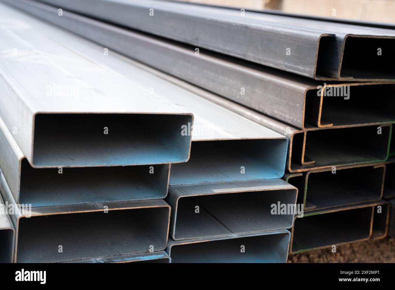Industrial warehouse stock of rectangular metal pipes for building and construction supplies ...