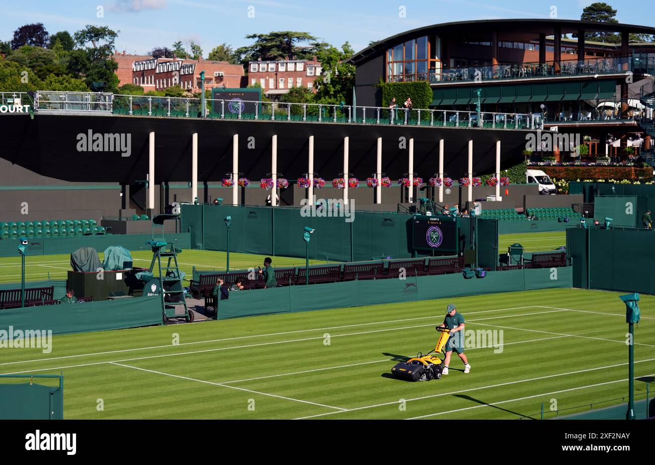 Ground staff prepare the outside courts on day one of the 2024 ...