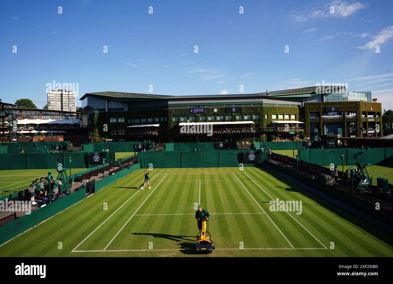 Ground staff prepare the outside courts on day one of the 2024 ...
